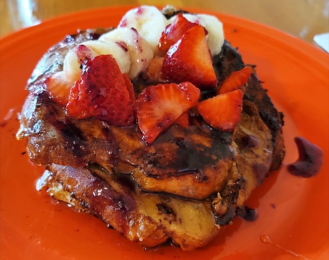 French toast that's clearly been to finishing school. Those fresh berries and syrup aren't just toppings&mdash;they're the supporting cast in a breakfast blockbuster.