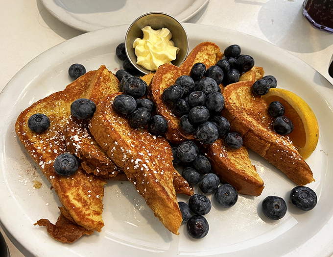 French toast that makes you question why you ever bothered with avocado toast, adorned with blueberries like little jewels of morning sunshine.