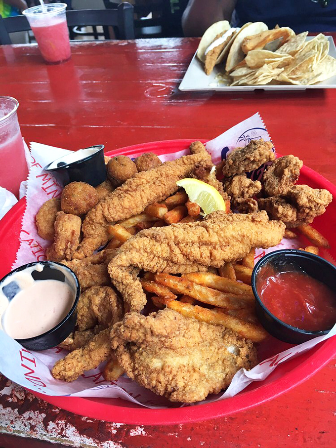 The seafood platter that answers the eternal question: "Why choose one fried delicacy when you can have them all?"