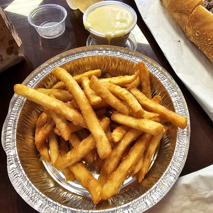 Golden, crispy fries that crackle with each bite, served with a side of nostalgia. The perfect sidekick to any sandwich superhero.