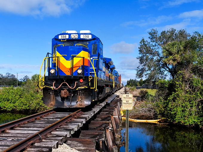 Engine 596 commands attention with its bold chevron design&mdash;like a mechanical peacock strutting through Florida's subtropical landscape.