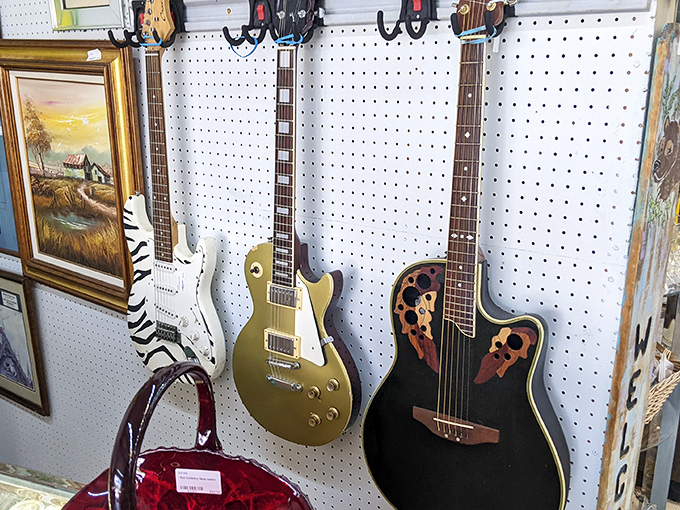 These silent guitars once filled rooms with music &ndash; now they wait on pegboard walls for new hands to bring their strings back to life.