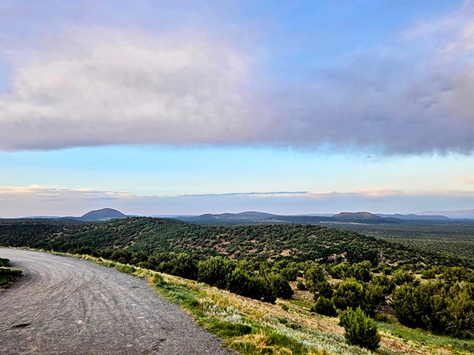 The winding dirt road hugs the hillside like it's afraid of heights, leading visitors to this expansive view worth every mile driven.