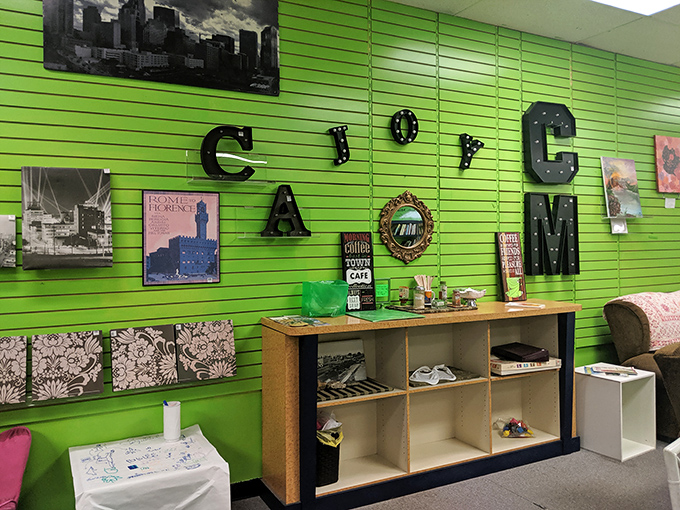 A boutique's bright green accent wall showcases local flair&mdash;proof that not everything in outlet malls is mass-produced corporate sameness.