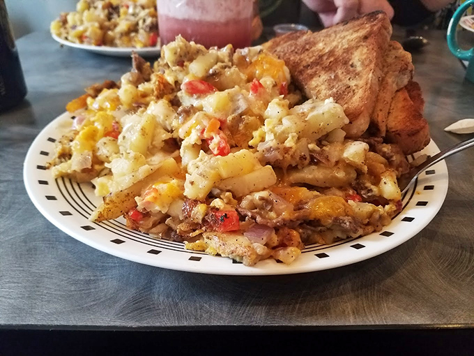 Breakfast hash that's more mountain than molehill. Those perfectly crisped potatoes, peppers, and proteins create a morning masterpiece that puts cereal to absolute shame.