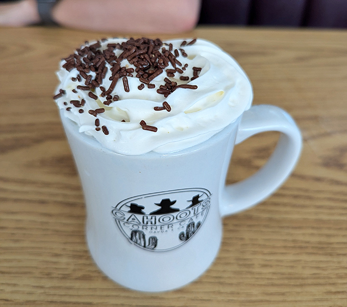 Not just hot chocolate, but a mug of liquid nostalgia topped with whipped cream and chocolate sprinkles&mdash;childhood in drinkable form.