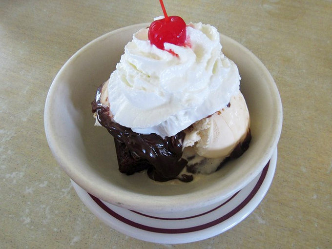 Hot fudge, ice cream, whipped cream, and a cherry on top&mdash;this sundae doesn't just satisfy your sweet tooth, it throws a party for it.