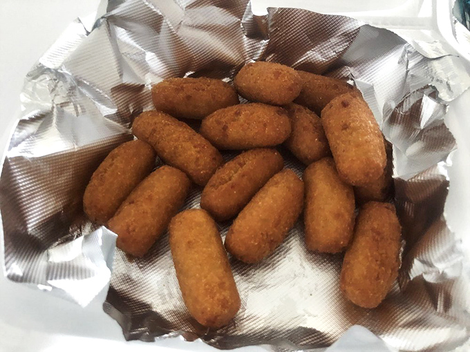 Hush puppies golden as sunrise, with that perfect crisp-to-fluffy ratio that makes you wonder why you don't eat them daily.