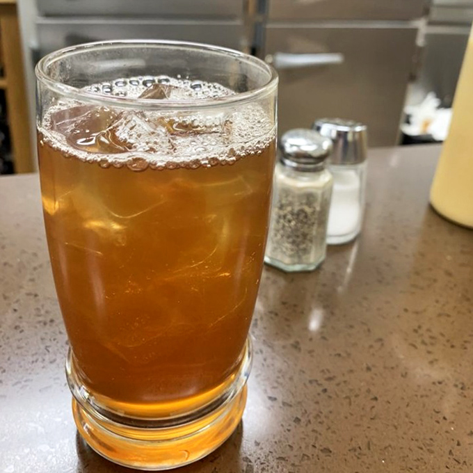 That iced tea isn't just a beverage&mdash;it's the perfect supporting actor in the burger drama about to unfold on your taste buds. 