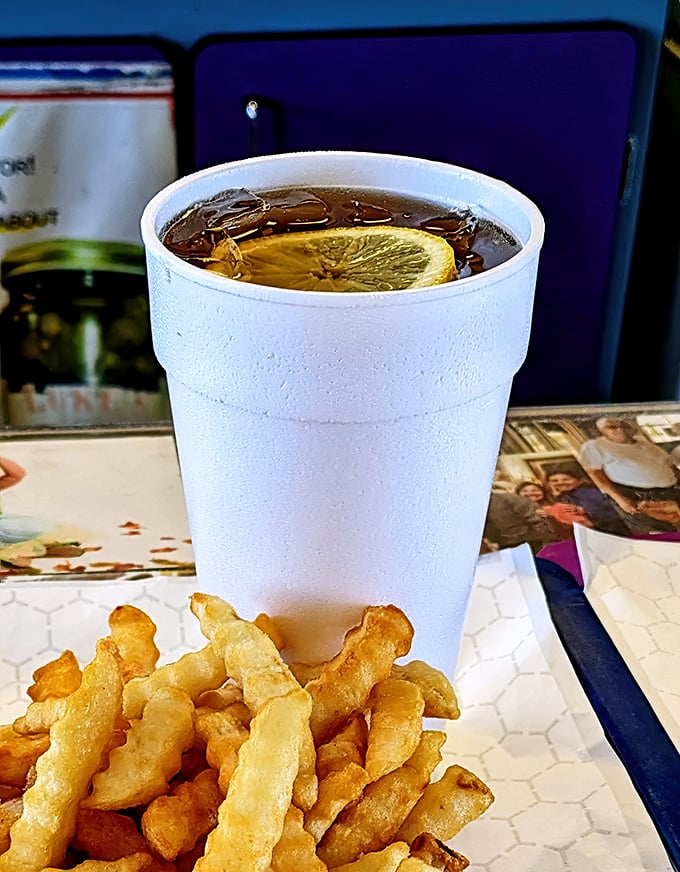 Nothing complements Chicago street food like a properly chilled iced tea with lemon. The crinkle-cut fries alongside are the supporting actors who steal scenes.