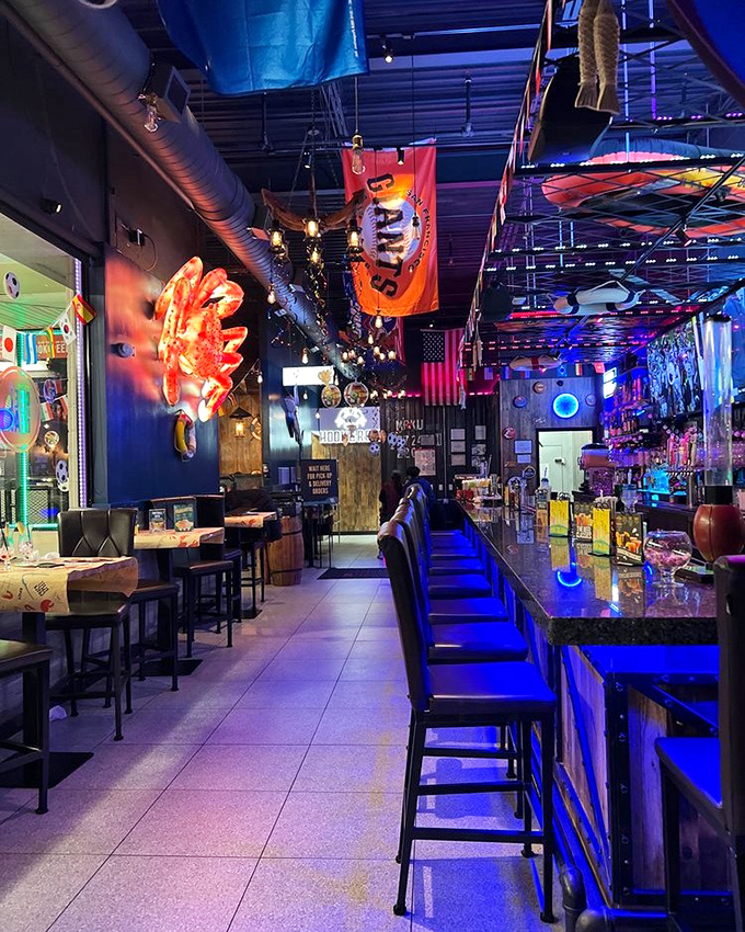 The bar area glows with promise, where neon lights and that giant crab on the wall remind you exactly what you came for. 