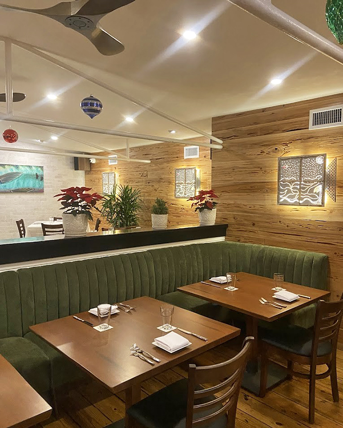 Green booths and wooden tables create an atmosphere that says, "Stay awhile." The kind of place where memories are made between bites.