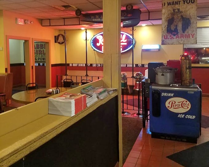 Classic Americana decorates the walls while a vintage Pepsi cooler stands guard. This isn't manufactured nostalgia&mdash;it's the real deal that chains try desperately to replicate.