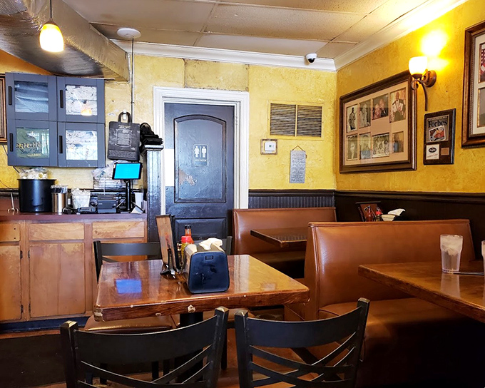 The warm yellow walls and vintage booths create an atmosphere that feels like Sunday dinner at grandma's&mdash;if grandma were an award-winning chef with decades of experience.