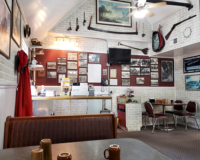 Western heritage adorns the walls while ceiling fans lazily spin above booths where ranchers and road-trippers break bread together.