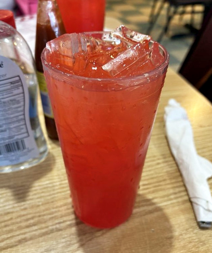 Sweet tea so perfectly amber it could be jewelry, served ice-cold in a no-nonsense plastic cup &ndash; the unofficial state beverage of Alabama done right.