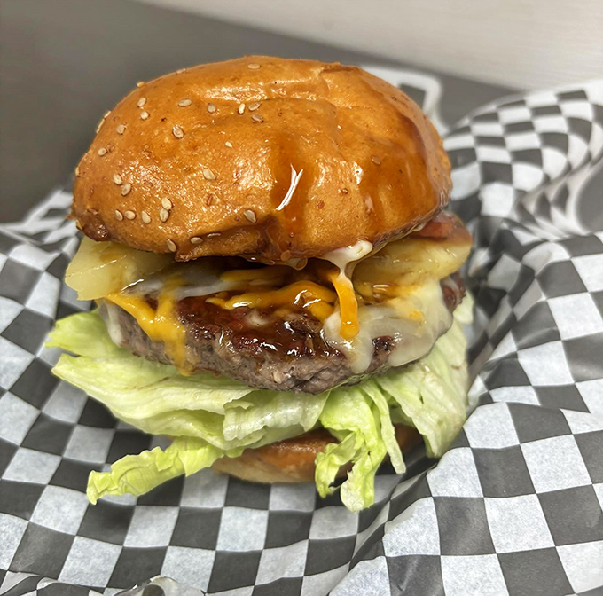 The Kahuna Burger &ndash; where sesame-studded bun meets melty cheese and a perfectly charred patty. Resistance is futile, napkins are mandatory.