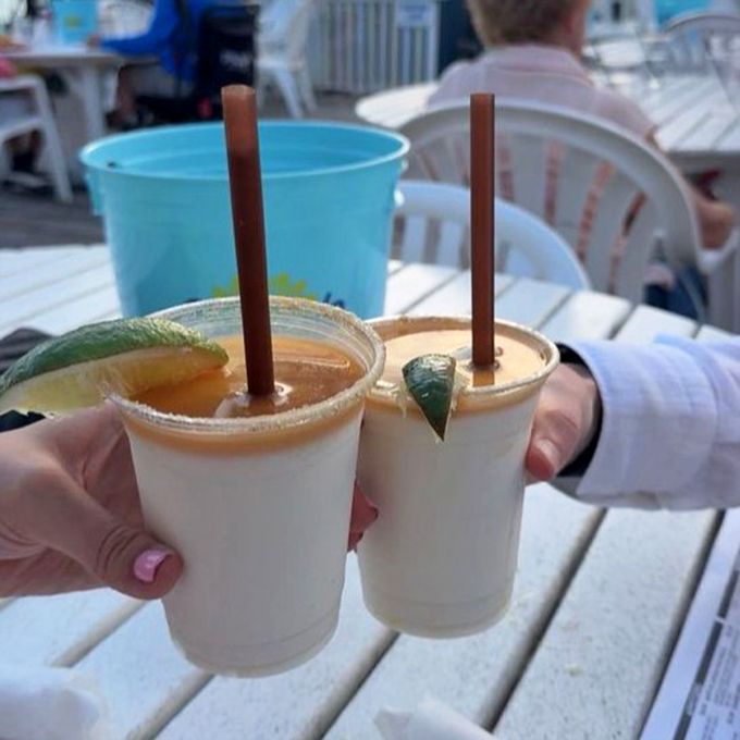 Key lime coladas: where vacation meets glass rim. Two straws mean you're legally required to share this moment with someone you like.