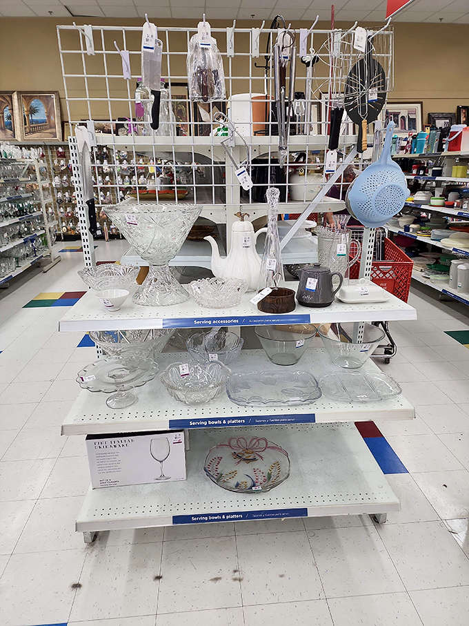 Crystal and glass serving pieces arranged like a museum exhibit &ndash; elegant entertaining without the first-owner price tag.