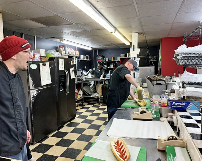 Behind the scenes, sandwich artisans work their magic on the checkered floor stage where Delaware's lunch dreams come true.