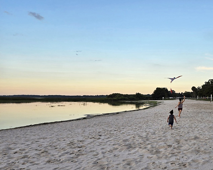 Sunset magic unfolds as children chase dreams along the shoreline. This isn't just sand and water&mdash;it's childhood bottled in golden hour light.