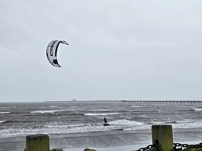 Even on gray days, adventure seekers find their thrills. This kitesurfer isn't deterred by the moody Northern California weather &ndash; they're embracing it.