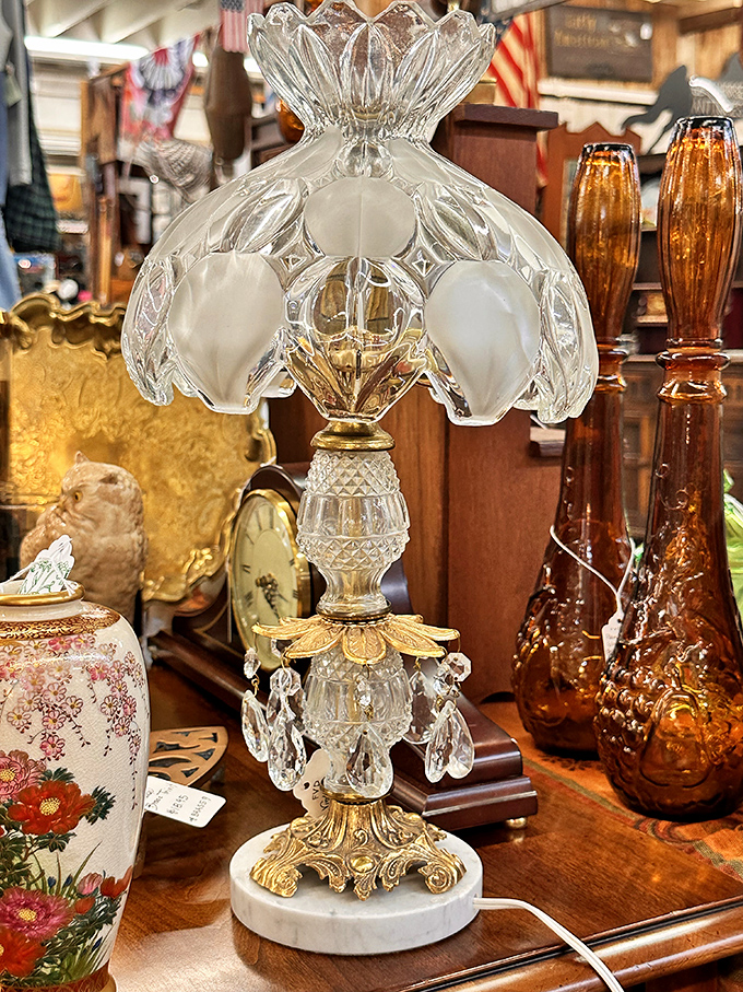 Crystal and brass come together in this lamp that's seen enough family dinners to write its own etiquette book.