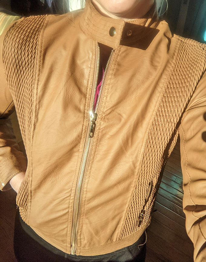 Leather jacket jackpot! This caramel-colored beauty with its textured panels is the vintage find that'll have friends asking, "Where'd you get that?"