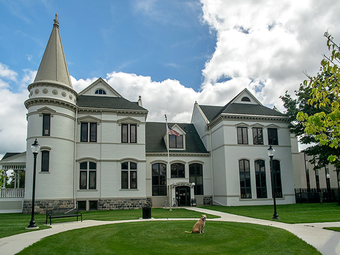 This stately white library building houses thousands of adventures that don't require a passport or depleting your retirement fund.