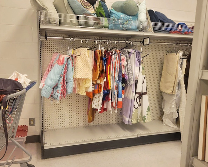 Children's clothing with plenty of growing room left. Those tiny dresses and pajamas have barely been worn before their previous owners sprouted up.
