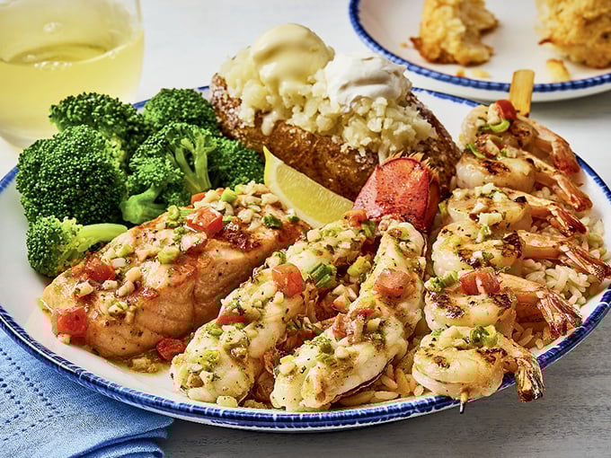 Land and sea in perfect harmony. When salmon, shrimp, and a loaded baked potato share a plate, everybody wins.
