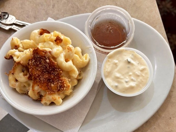 Mac and cheese that doesn't hide behind pretentious ingredients – just honest, creamy comfort with a golden-brown top that makes a satisfying crack when your spoon breaks through.