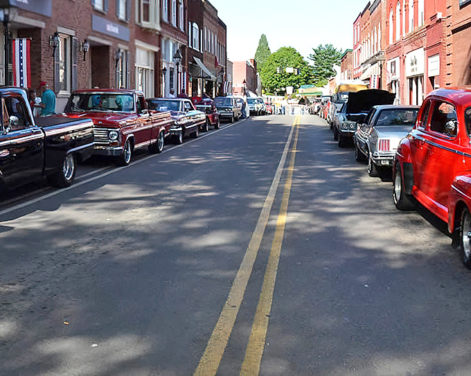 Morning light bathes the red brick buildings in golden warmth, highlighting architectural details that modern construction has long forgotten.
