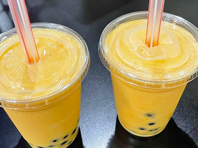 Bright mango bubble tea topped with those chewy tapioca pearls makes you wonder why every beverage doesn't include something fun to chew.