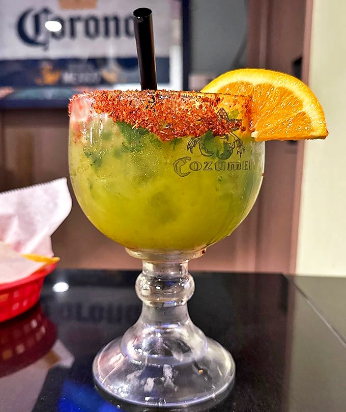 Not just a margarita, but a vacation in a glass. That tajin rim is the passport stamp to Flavortown you didn't know you needed.