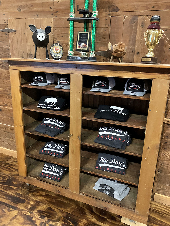 Trophy shelf and merch display: where barbecue bragging rights and take-home souvenirs prove this isn't their first rodeo.