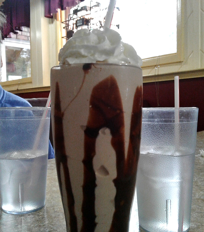 This chocolate milkshake isn't just a drink, it's an architectural achievement. Whipped cream skyscraper included at no extra charge.