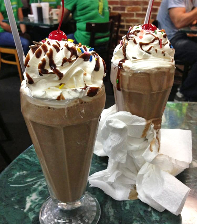 These aren't just milkshakes; they're drinkable monuments to excess, topped with enough whipped cream to make your cardiologist start drafting a strongly worded letter.