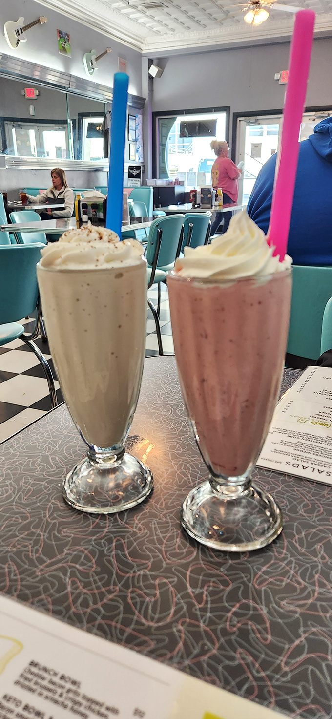 Milkshakes thick enough to require both straw and spoon, topped with whipped cream mountains. These aren't drinks; they're desserts in disguise.