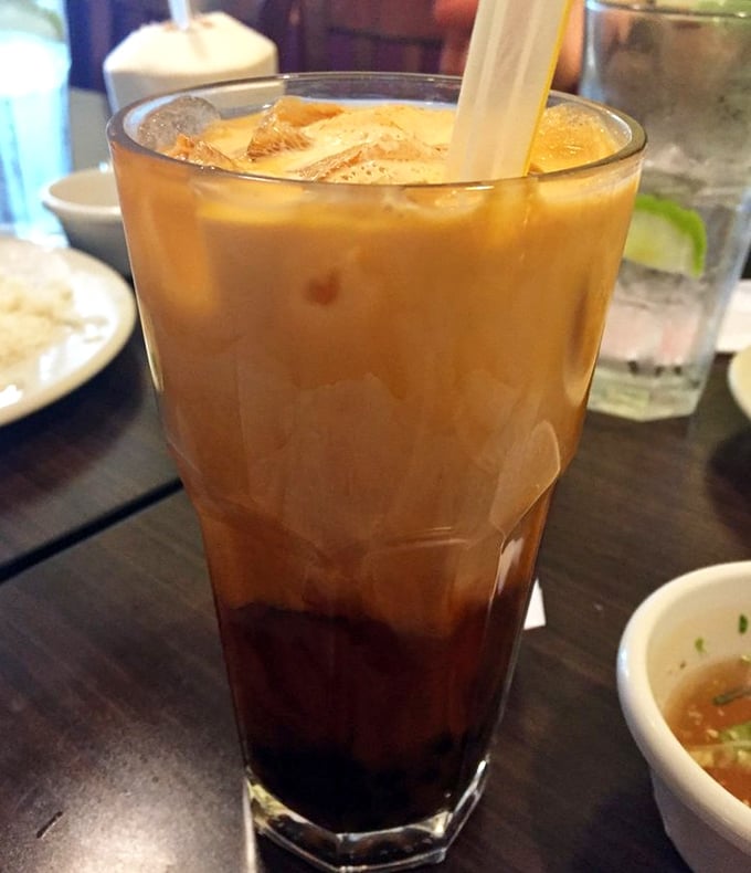 Vietnamese iced coffee with its signature layers of strong brew and sweetened condensed milk is liquid energy in a tall glass.