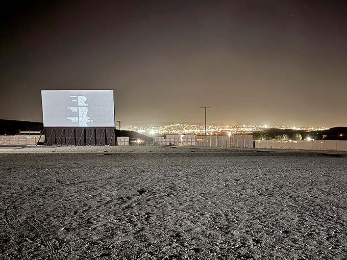 As darkness envelops the desert, the illuminated screen becomes the brightest star in Barstow's night sky.