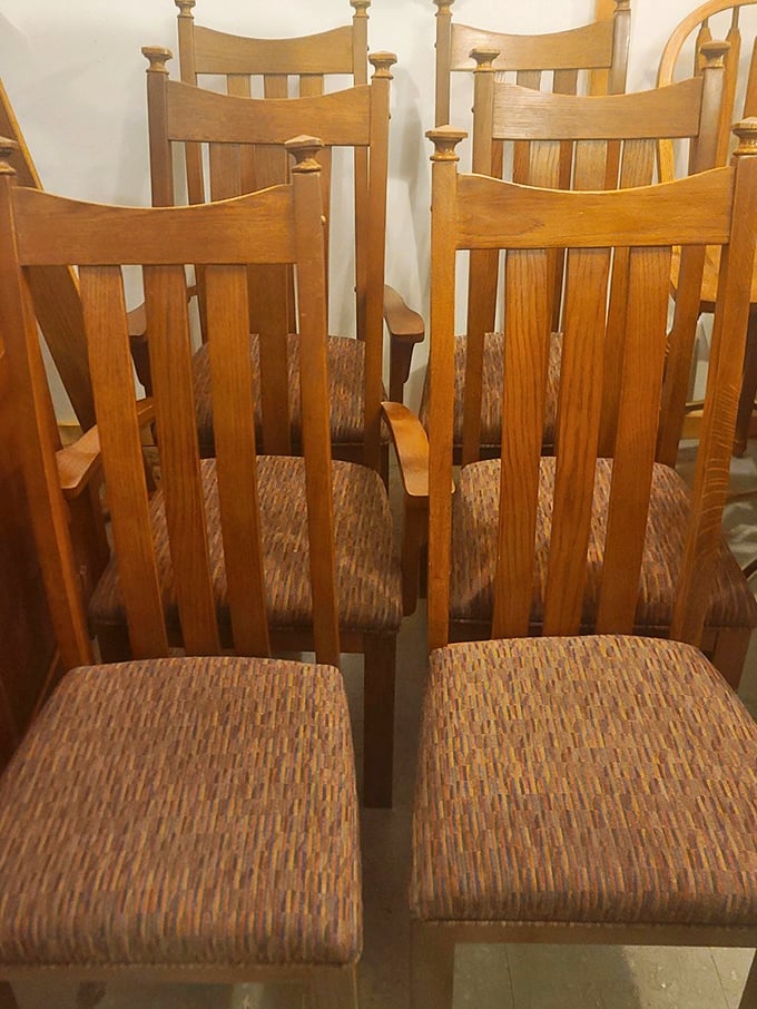 Mission-style oak dining chairs stand at attention like soldiers from another era, their craftsmanship a testament to furniture that was built to last.