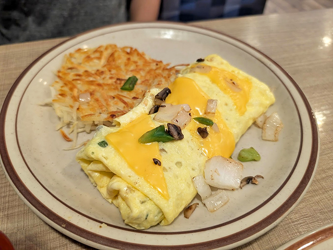 An omelet that doesn't need fancy ingredients to impress&mdash;just perfectly executed basics with hashbrowns that achieve the crispy-fluffy paradox.