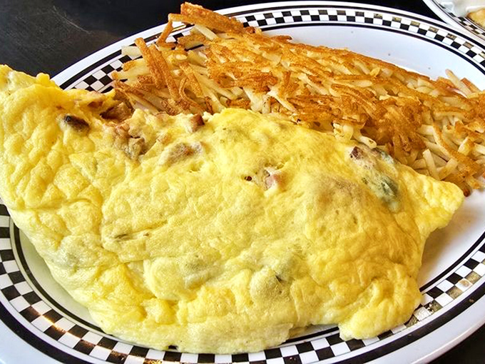 This omelet could teach a masterclass in breakfast perfection. Paired with those crispy hash browns, it's the morning duo your taste buds deserve.