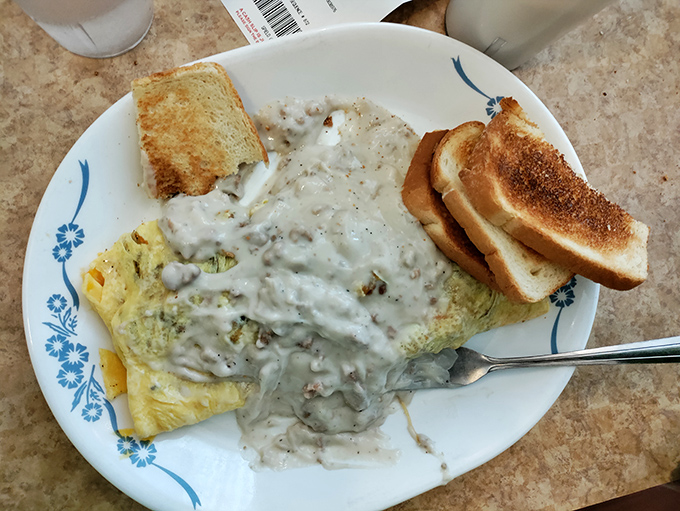 This omelet didn't just get smothered in gravy&mdash;it got adopted by it. Breakfast that doubles as lunch and possibly a nap afterward.