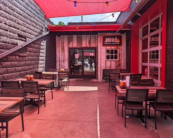 The outdoor seating area feels like your coolest friend's backyard—if your friend happened to smoke the best barbecue in Michigan.