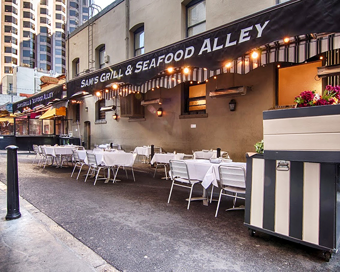 Outdoor dining at Sam's feels like stumbling upon a secret club where white tablecloths meet fresh air and Financial District hustle.