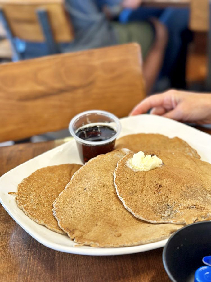Golden pancakes with a pat of melting butter and syrup on standby&mdash;simple perfection that needs no filter or fancy introduction.