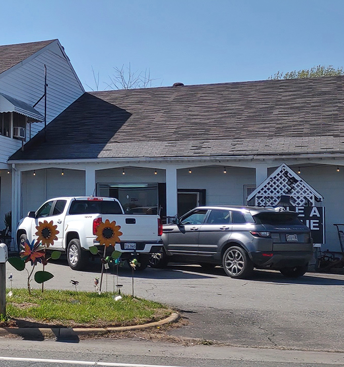 Even the parking area hints at the charm within, with decorative metal sunflowers standing guard. Your car might be the newest thing here.