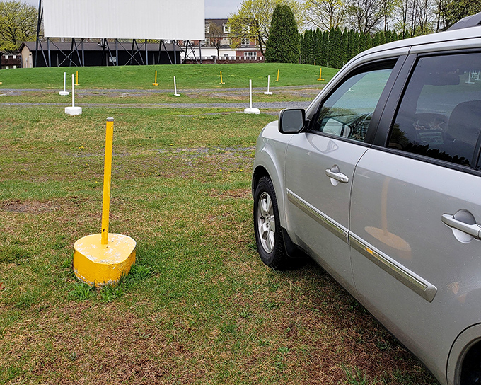 Yellow parking markers guide you to the perfect spot &ndash; not too close, not too far from cinematic glory.